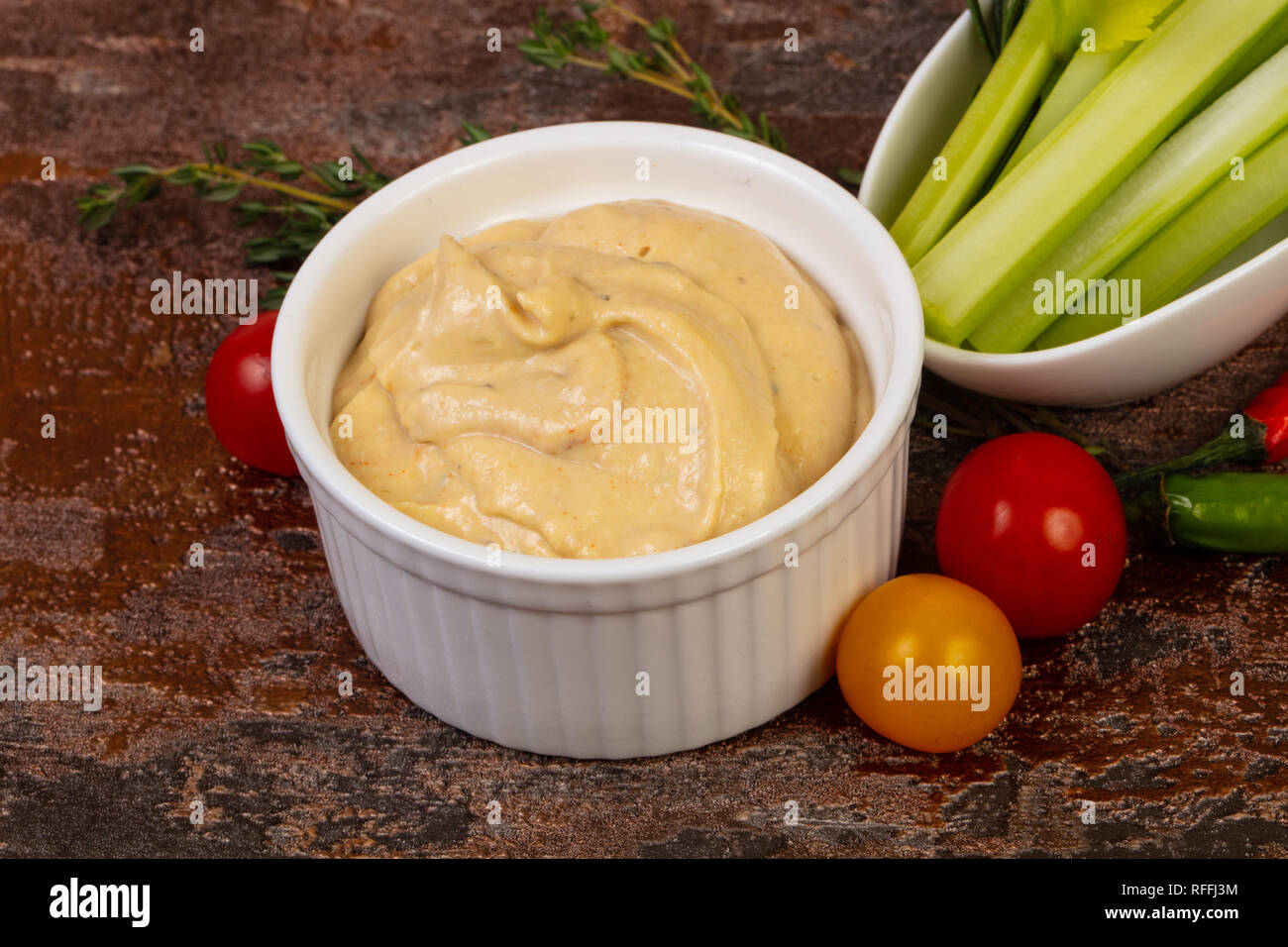 Vegan cuisine - Humus with celery sticks Stock Photo - Alamy