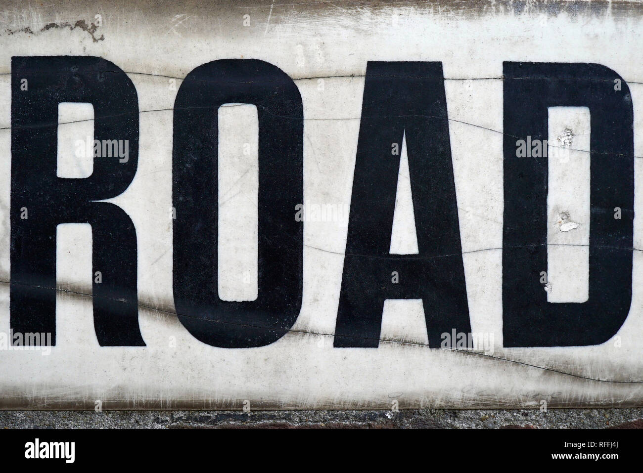 A Close Up Of The Word Road In Black On A Sign Stock Photo - Alamy