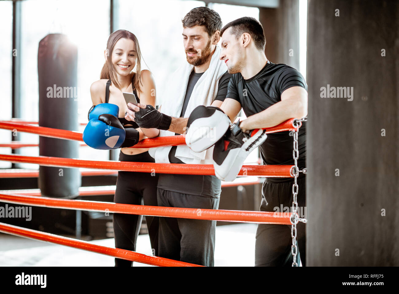 Young active friends having fun, standing together after the training ...