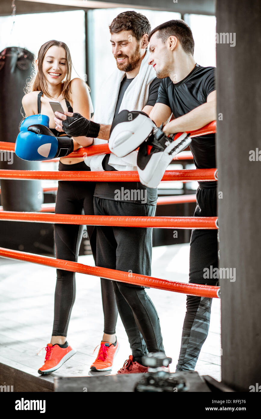 Young active friends having fun, standing together after the training ...