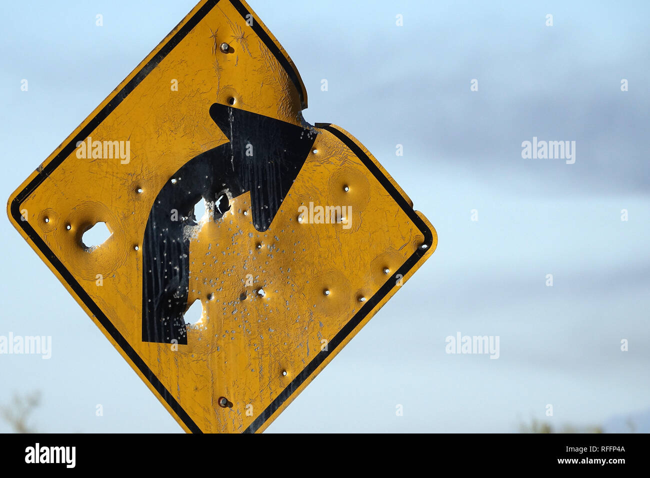 Bullet holes in road sign hi-res stock photography and images - Alamy