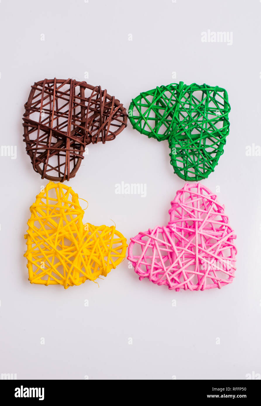 Four colorful straw hearts forming a shape Stock Photo - Alamy