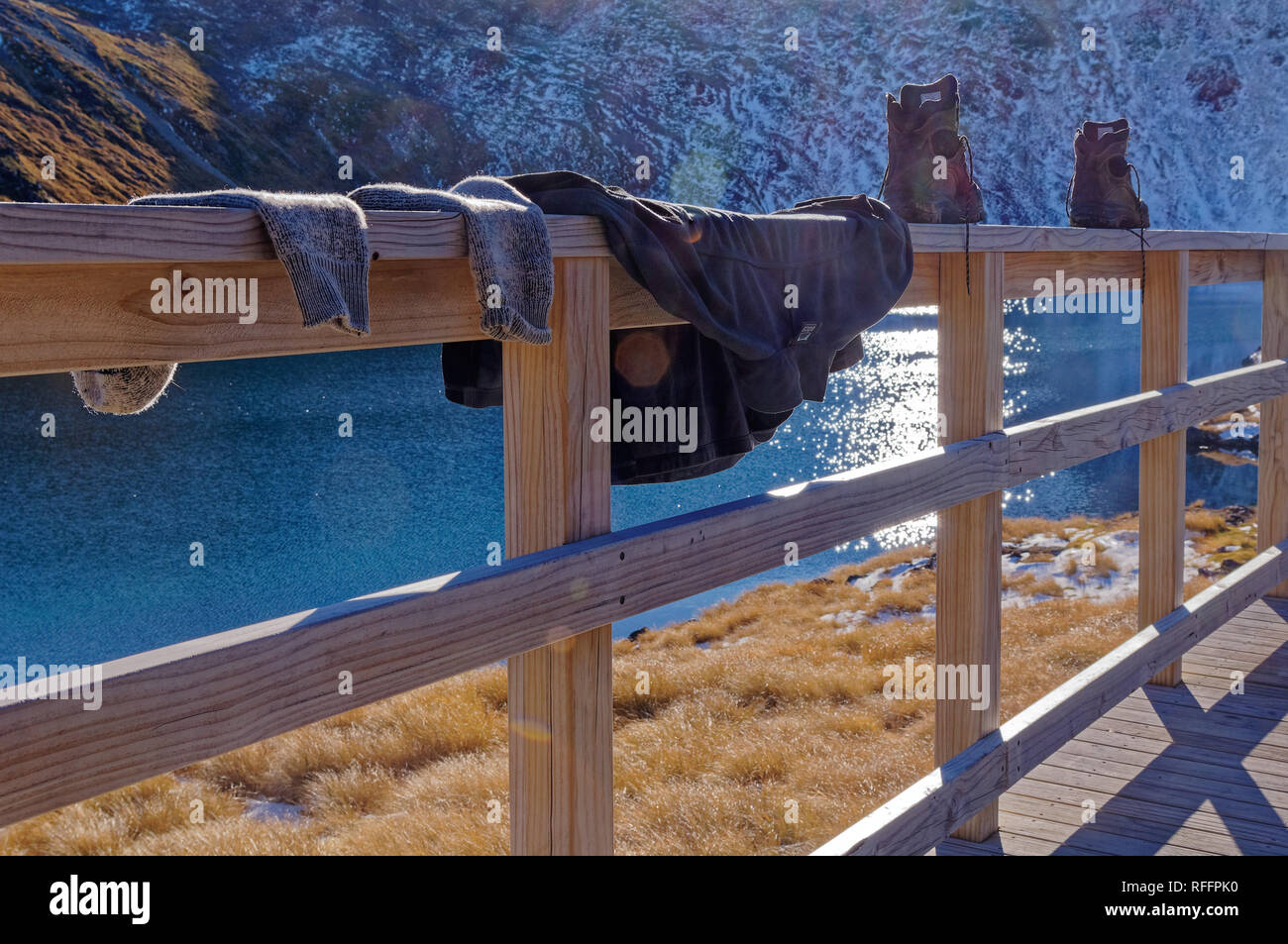 Sweaty socks and boots drying on a railing at Angelus hut, DoC hut or ...