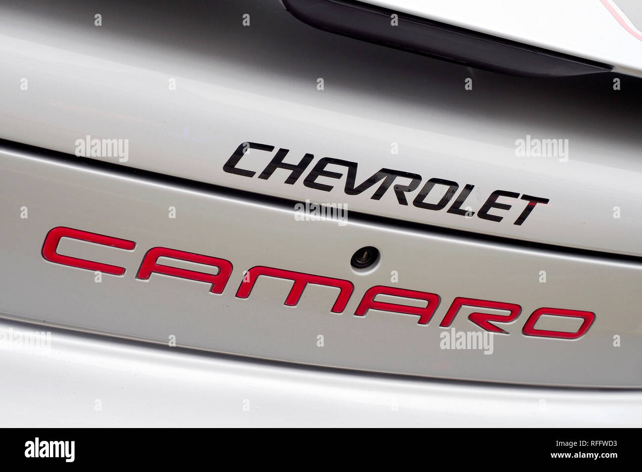 A silver fourth generation Chevrolet Camaro sports coupe from the late ...