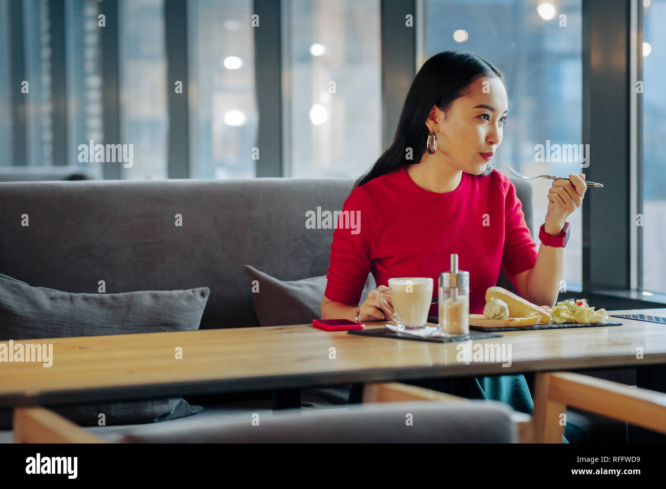 Happy asian woman sitting table hi-res stock photography and images - Alamy