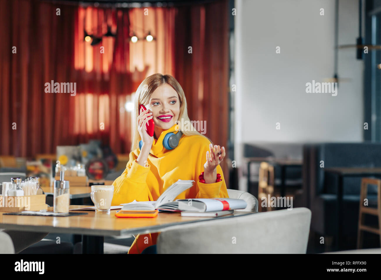 Blonde-haired woman calling her boyfriend while waiting for him Stock ...
