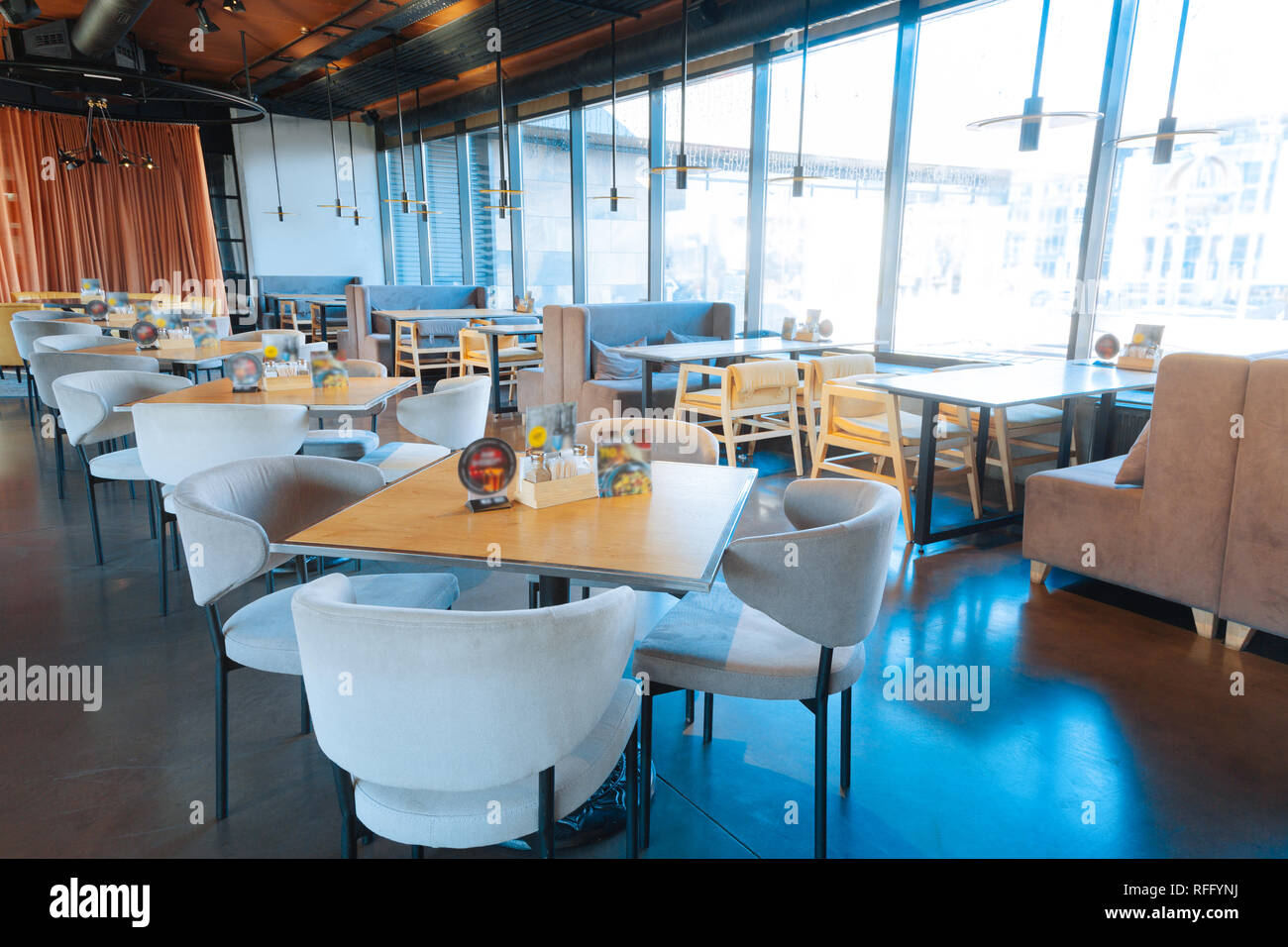 Girl standing near tables hi-res stock photography and images - Alamy