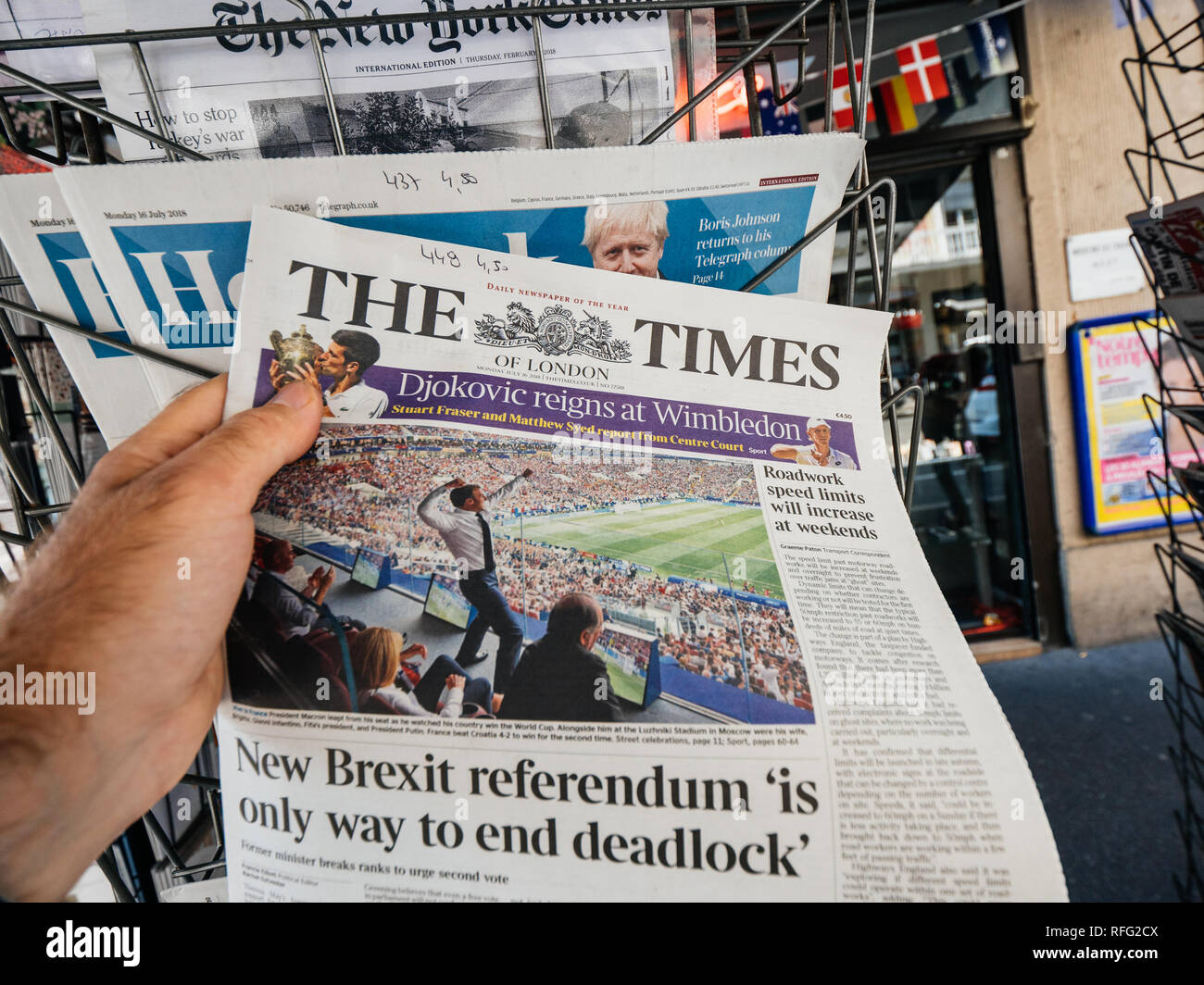 PARIS, FRANCE - JUL 16, 2018: Man buying The Times with Emmanuel Macron ...