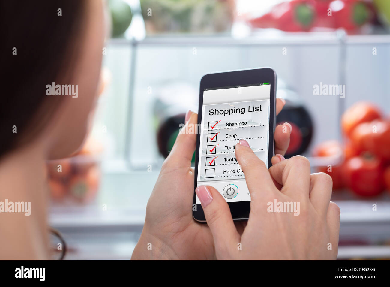 Close-up Of A Woman's Hand Marking Shopping List On Mobile Phone Stock ...