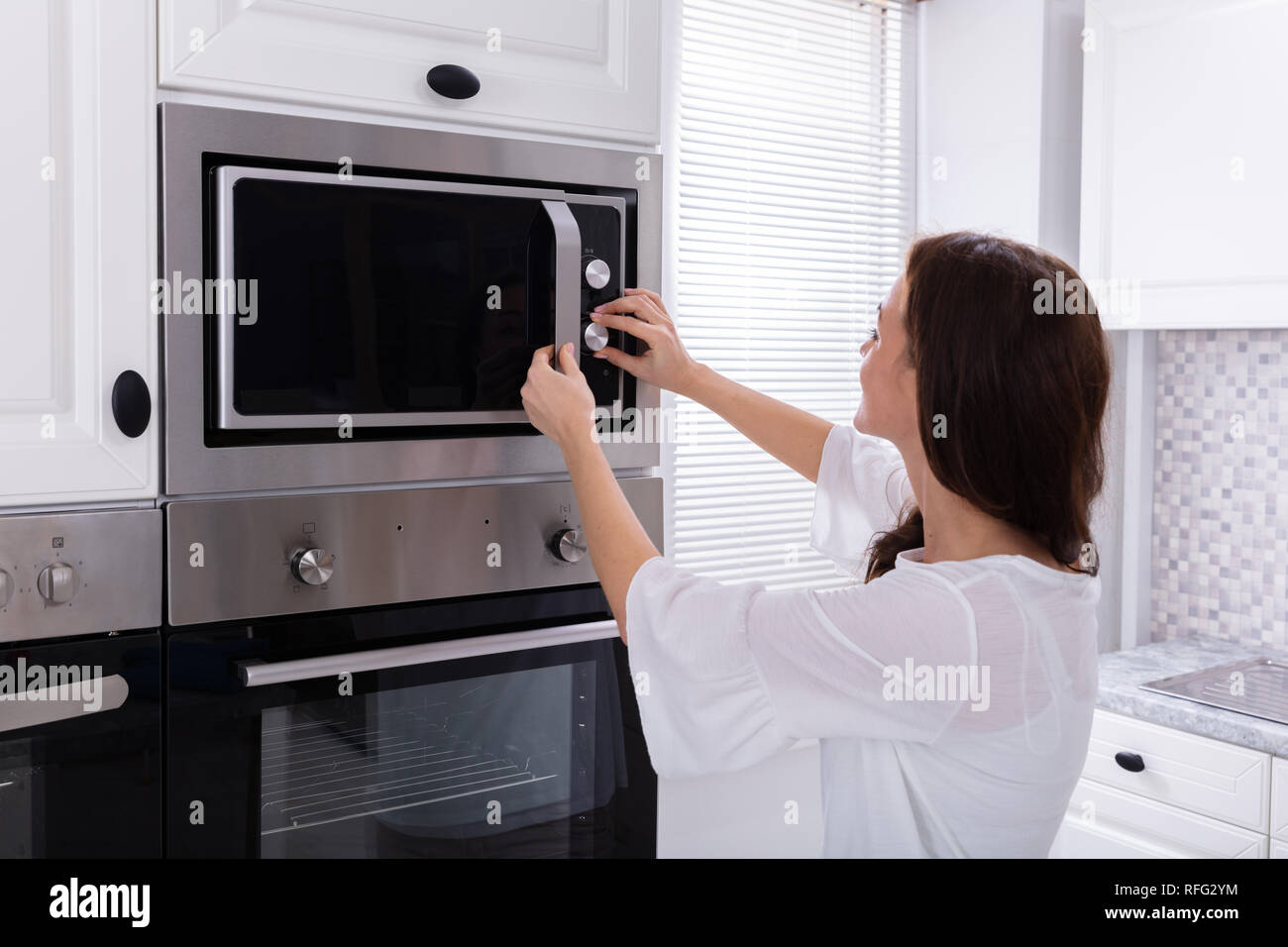 Using microwave oven hi-res stock photography and images - Alamy