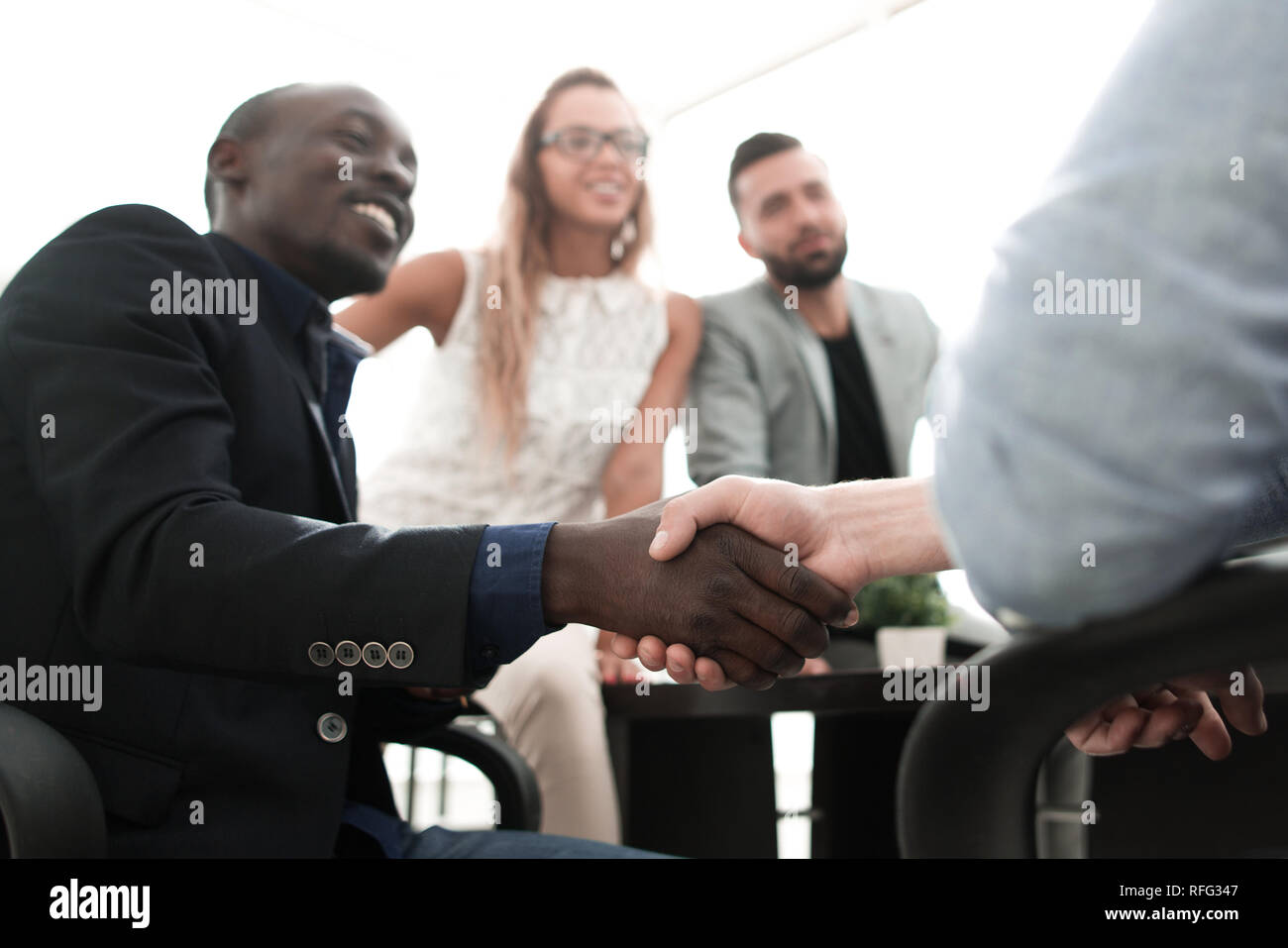 handshake colleagues in the workplace Stock Photo - Alamy
