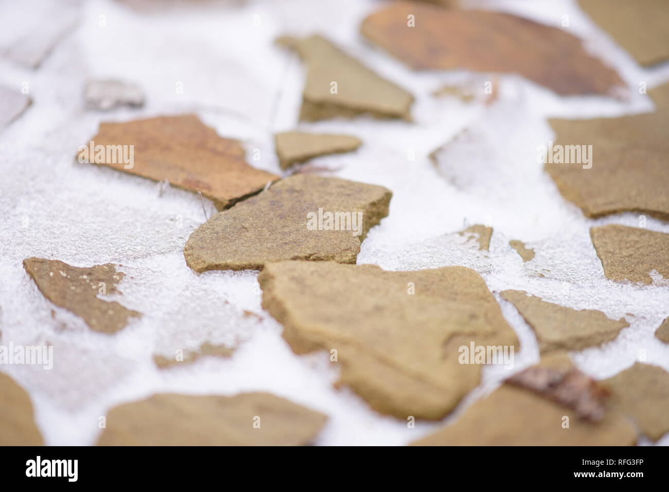 Winter pavement background. Snow covered wild stone paving tiles Stock ...
