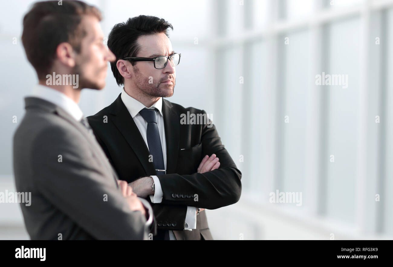 business partners talking near the office window Stock Photo - Alamy