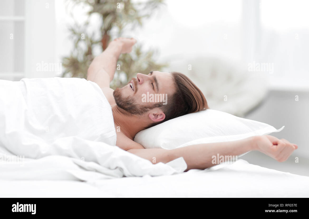 business man falling asleep in the comfortable hotel room Stock Photo ...