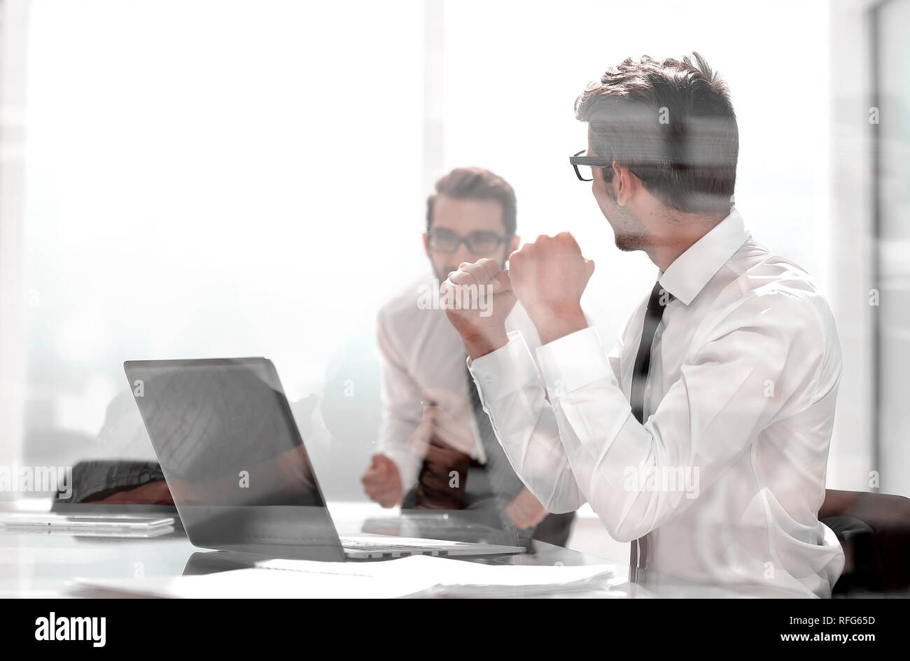 Happy employees looking online hi-res stock photography and images - Alamy