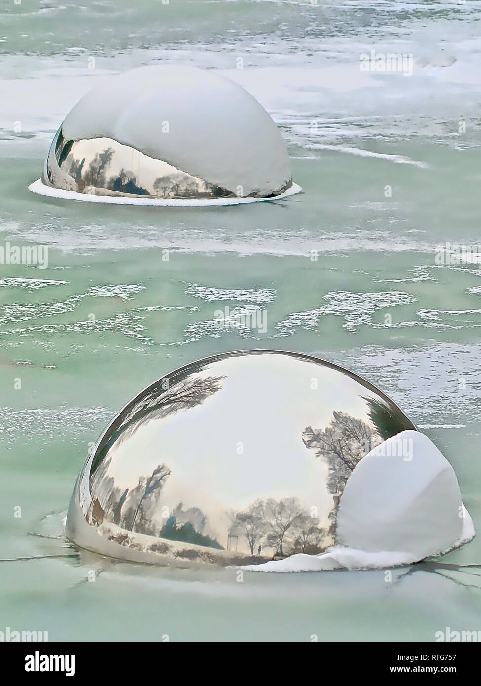 Silver balls in blue ice water Stock Photo - Alamy