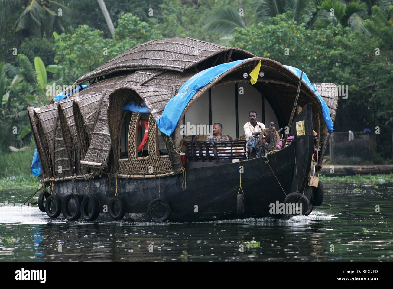 Typical rice boats on the Backwaters, a canal system along the ...