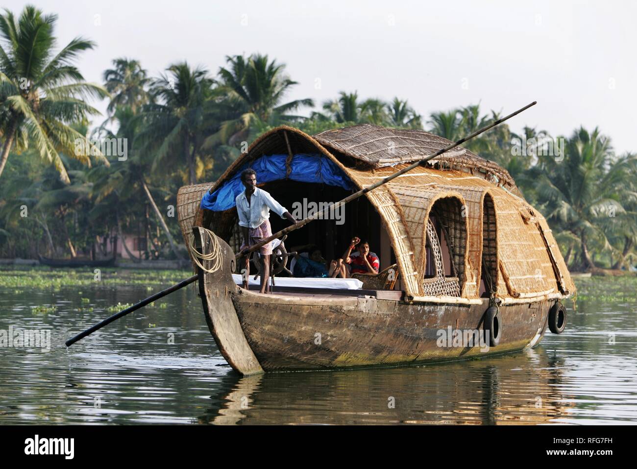 Typical rice boats on the Backwaters, a canal system along the ...