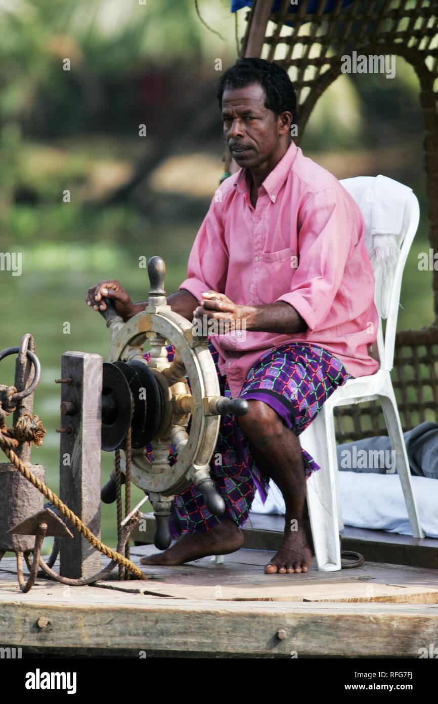 Typical rice boats on the Backwaters, a canal system along the ...