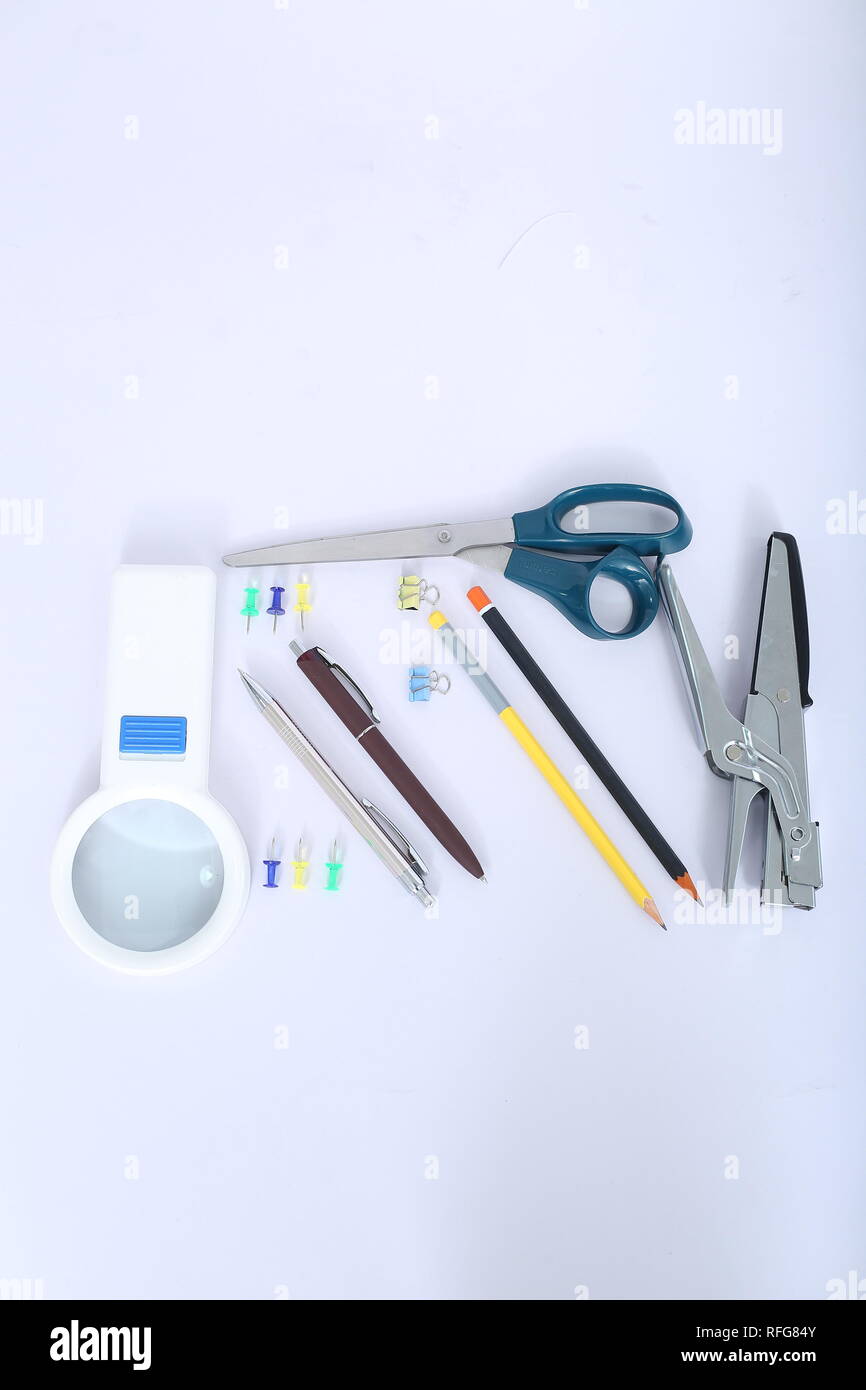 Top view of ball pen, stapler, pencil, scissor, paper clip and ...