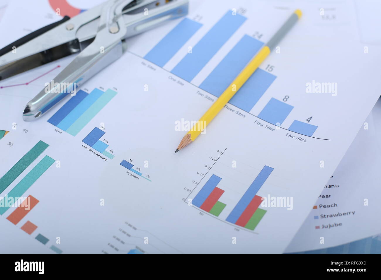 Picture of pen and stapler on the graph paper Stock Photo - Alamy