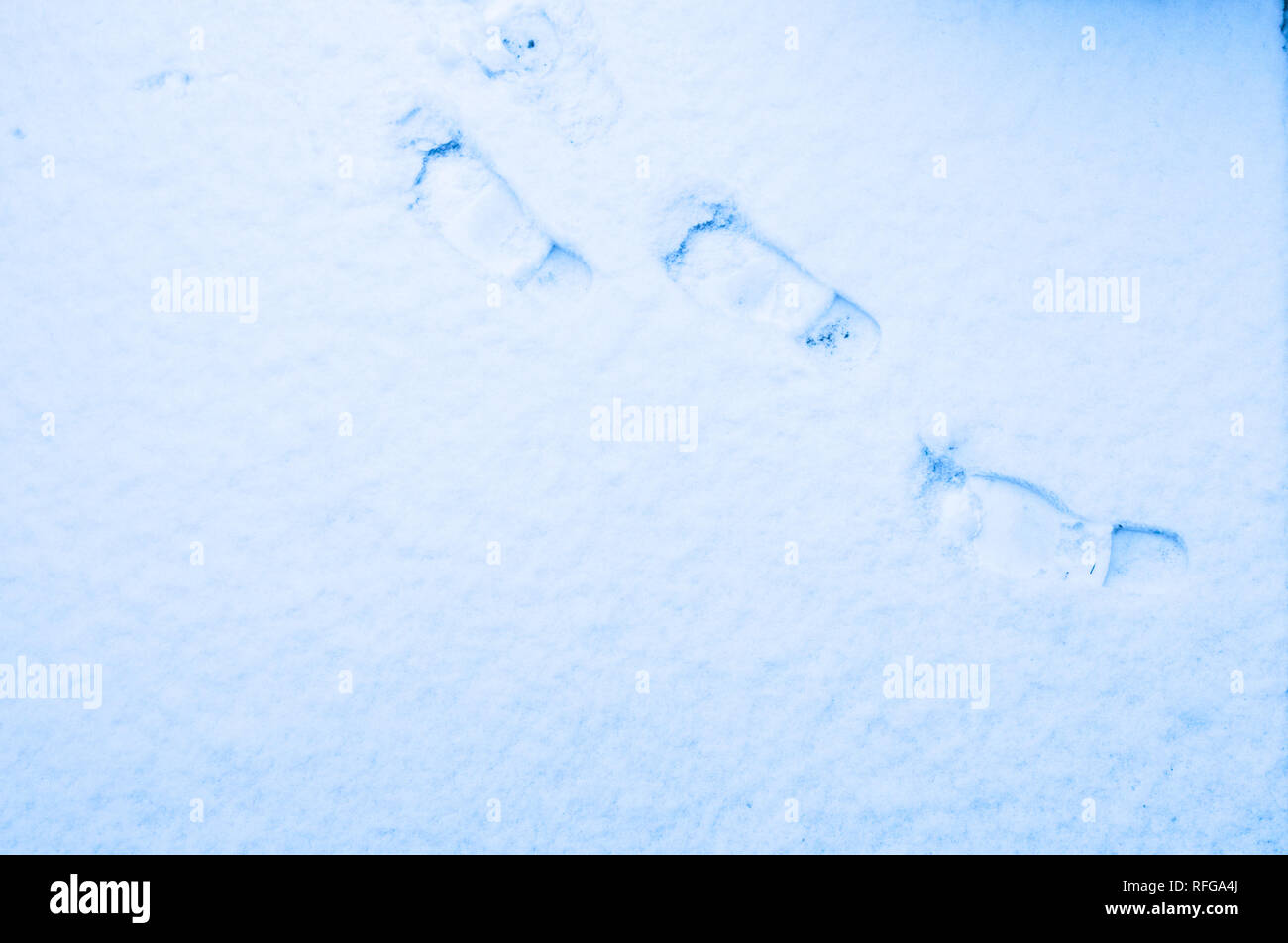 Abstract foot prints on the snow Stock Photo - Alamy