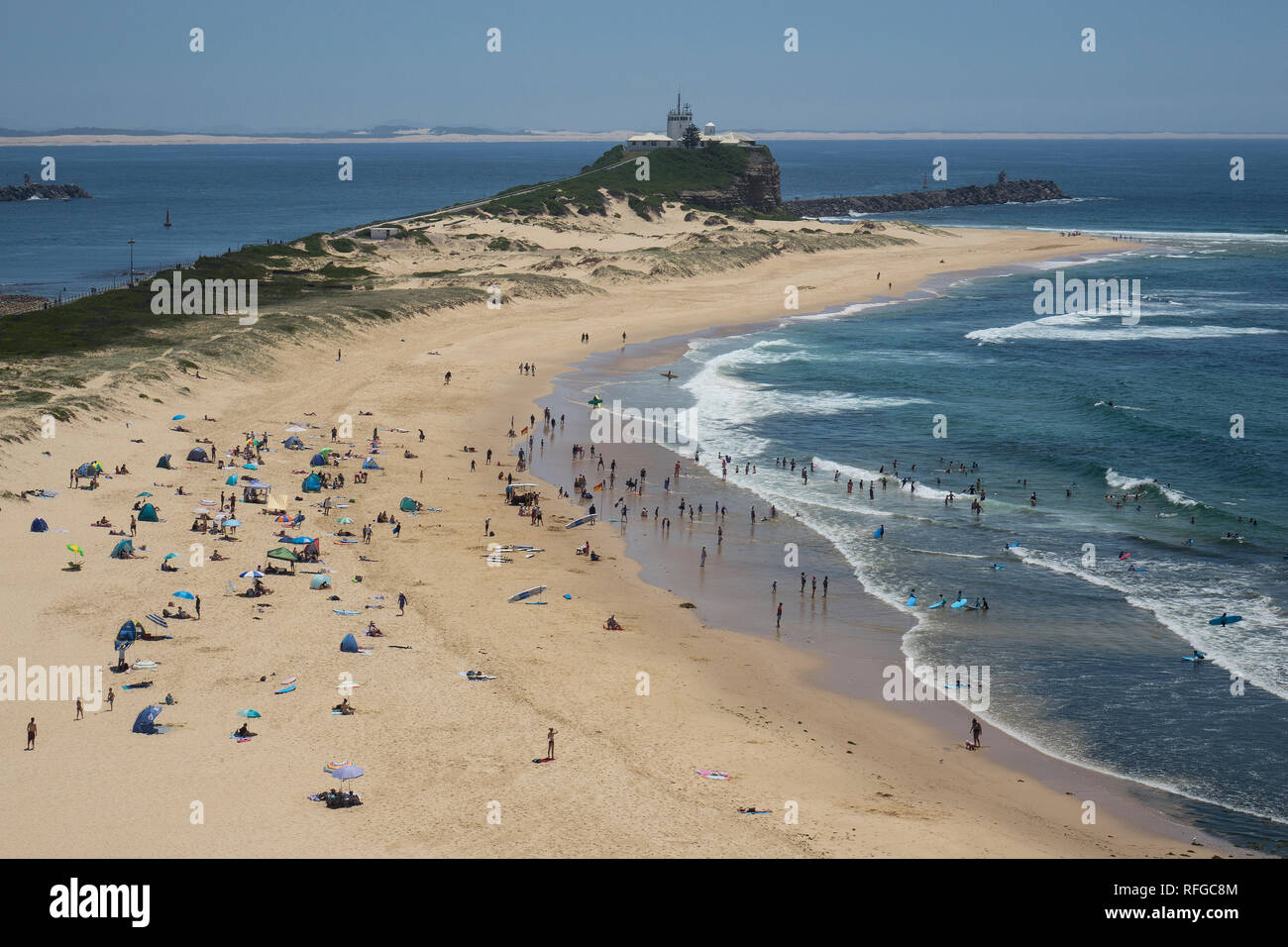 Australia, New South Wales, Newcastle, Nobby's beach & lighthouse Stock ...