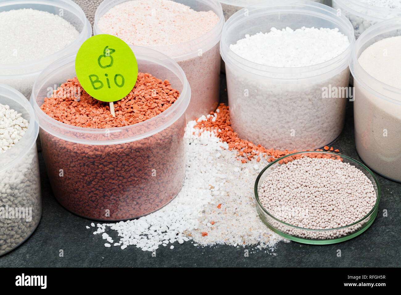 Garden background with mineral fertilizers balls. Complex mineral ...