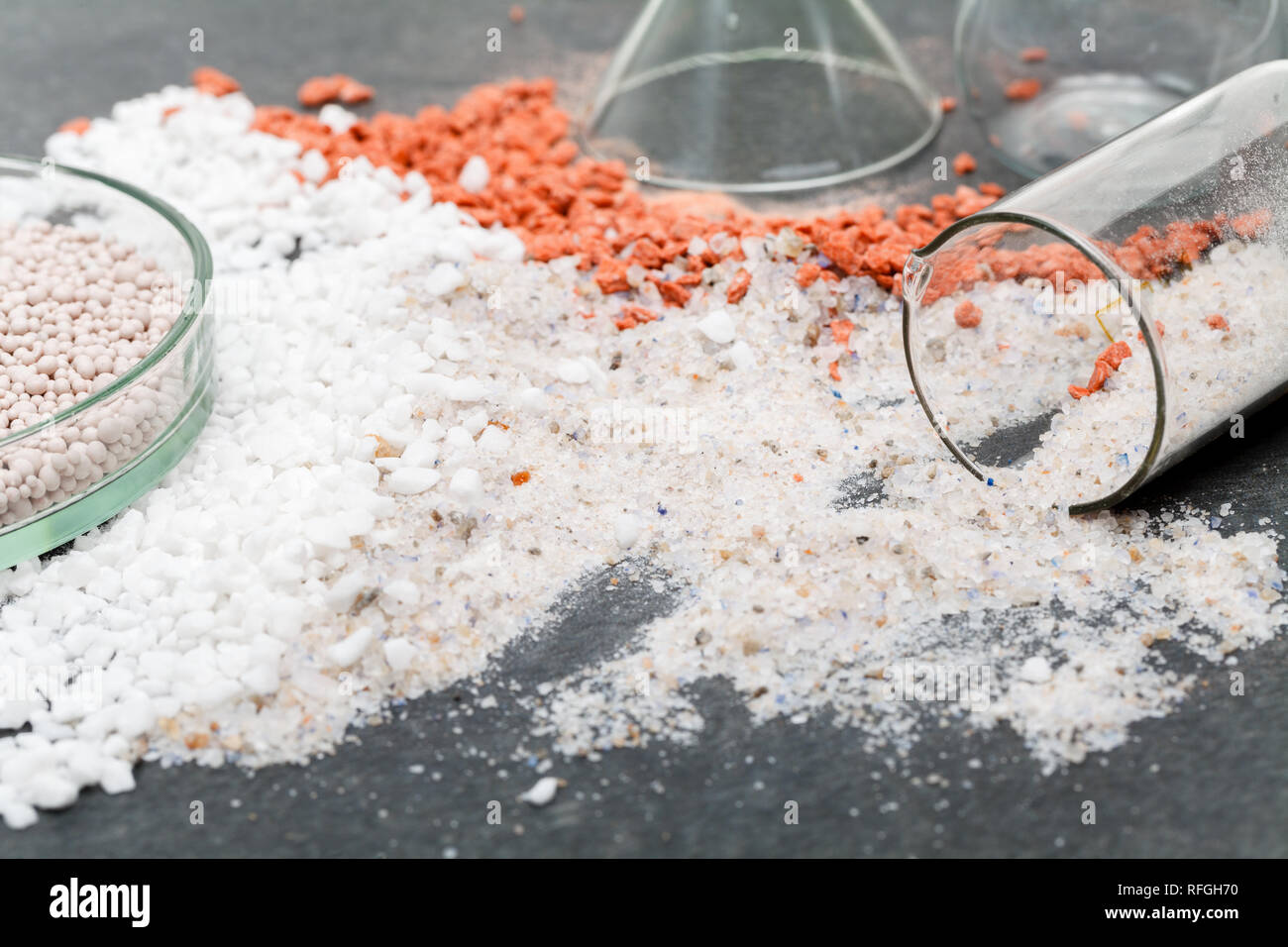 Chemical fertilizer on soil background Stock Photo - Alamy