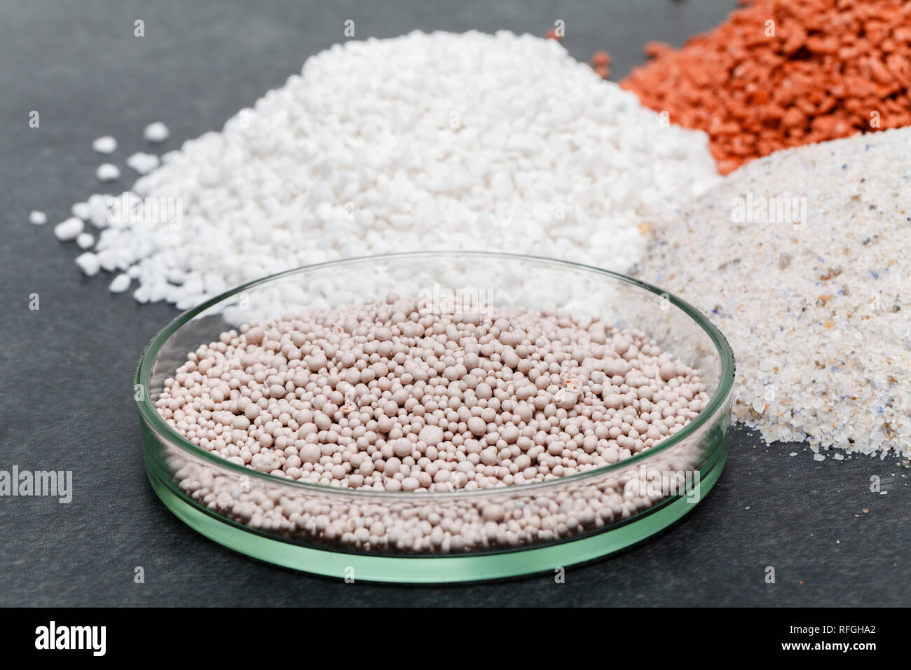 Mineral fertilizers granules in glass jar Stock Photo - Alamy