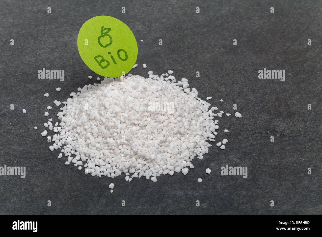 Chemical fertilizer on soil background Stock Photo - Alamy