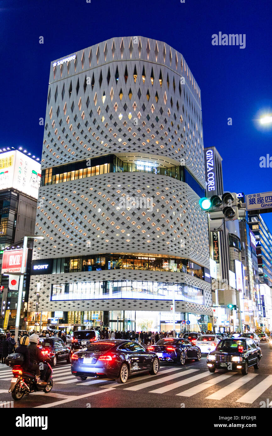 The white Ginza Place building with aluminium panel facade during blue ...