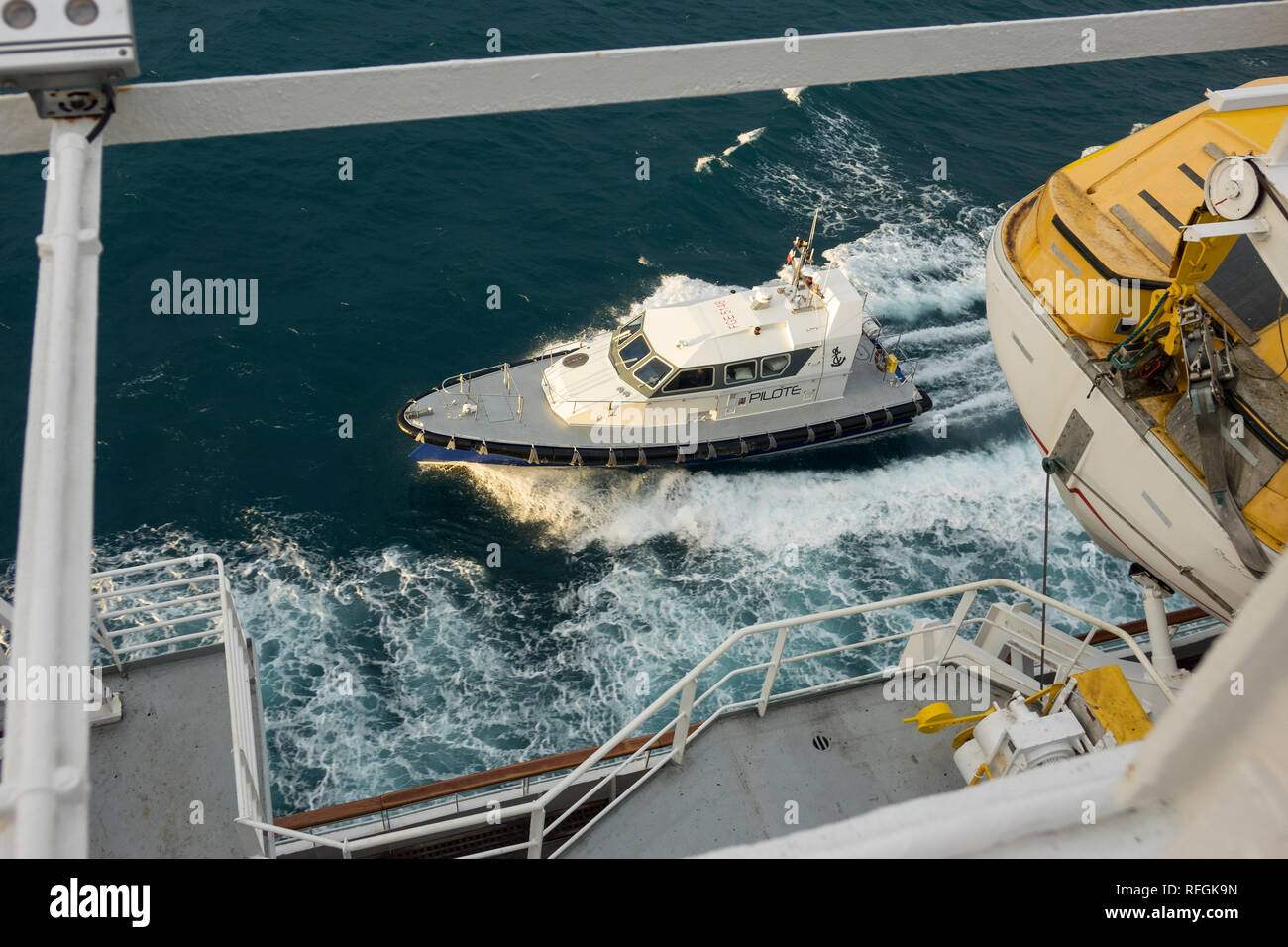 Pilot boat approaches ship Stock Photo - Alamy