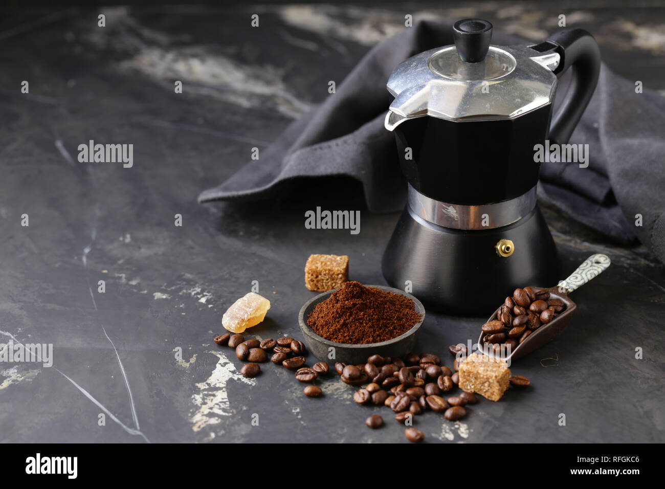 still life of coffee, grains and ground on a black background Stock ...