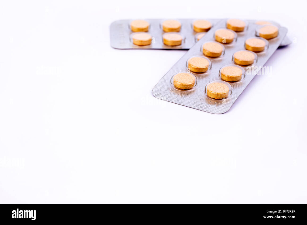 Beige pills in silver plastic packs - blisters. Global pharmaceutical ...