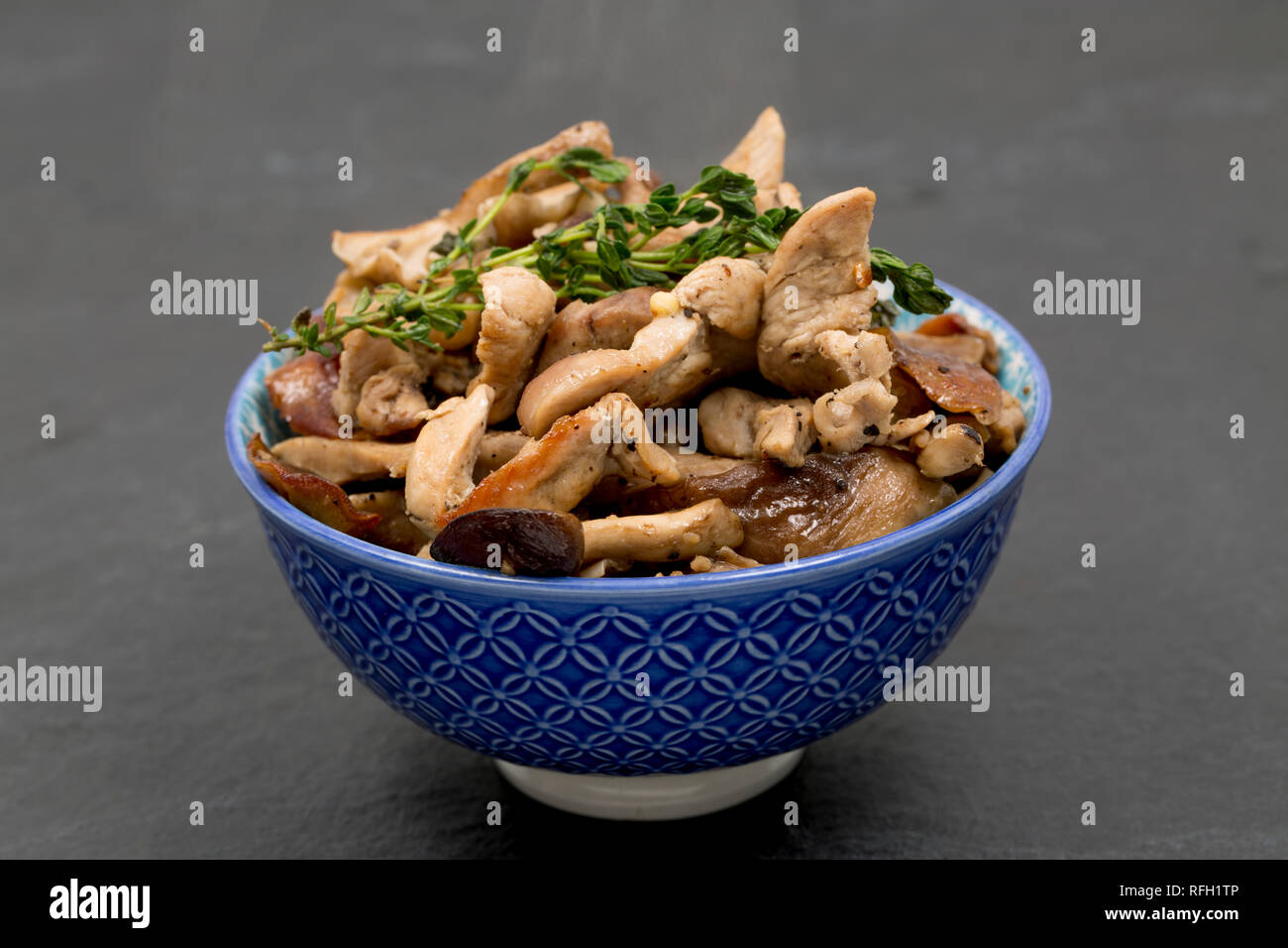 Homecooked pheasant fillet that has been cut into strips and stir fried ...