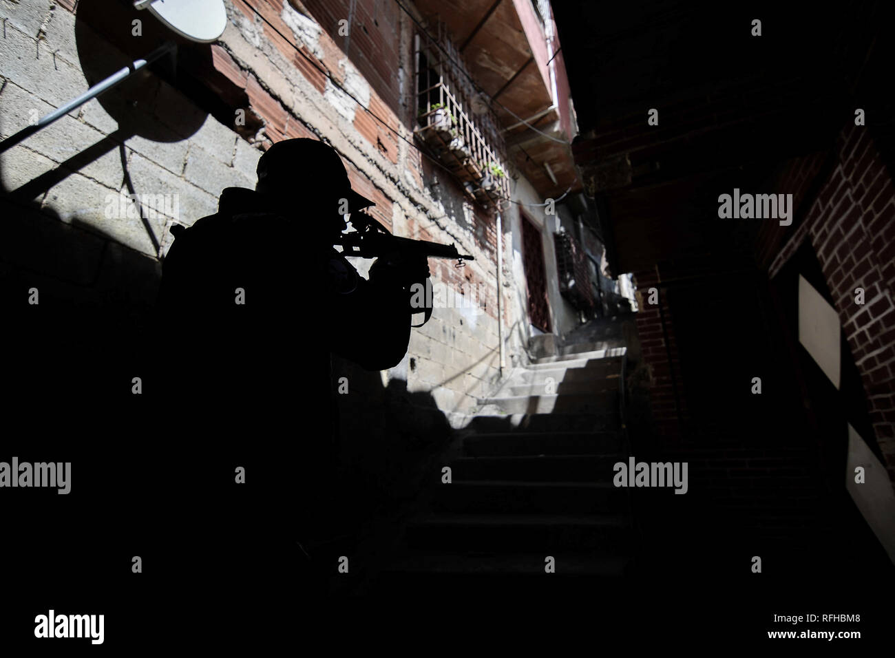 Caracas, Venezuela. 25th Jan, 2019. A member of the Bolivarian National ...