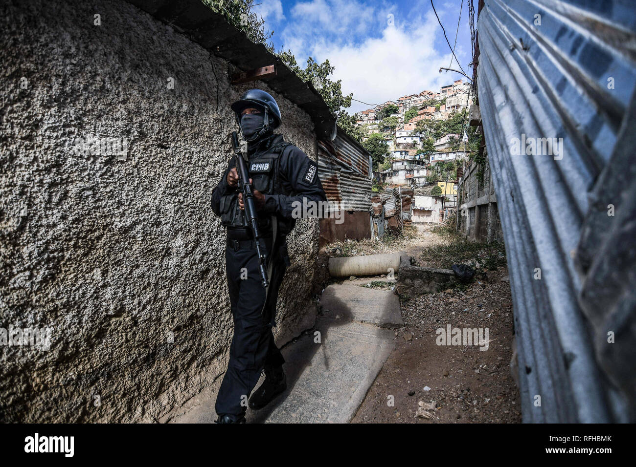Caracas, Venezuela. 25th Jan, 2019. A member of the Bolivarian National ...
