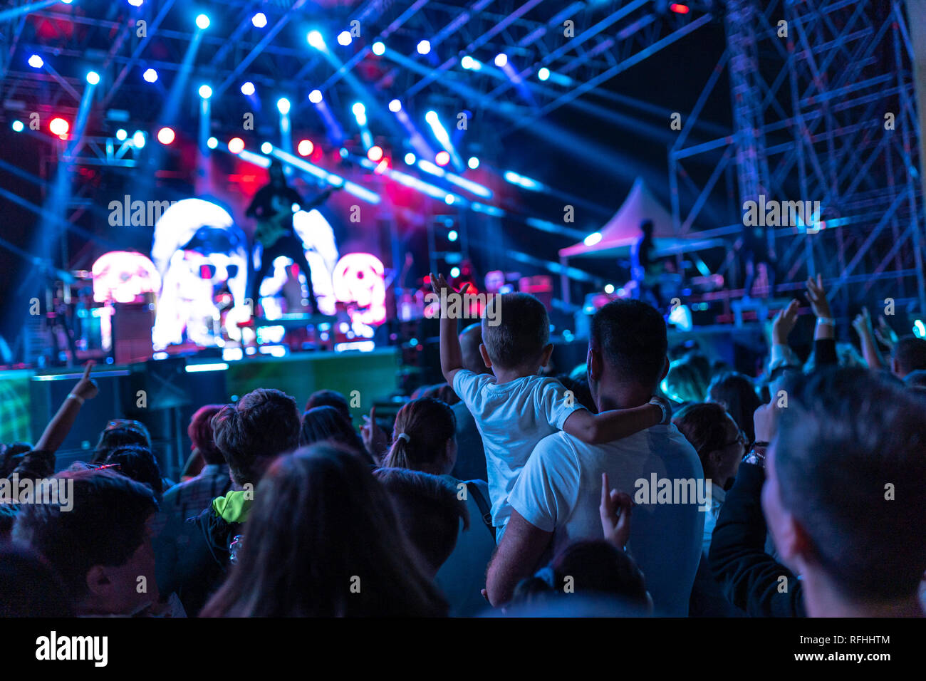 Family attending a concert Stock Photo - Alamy