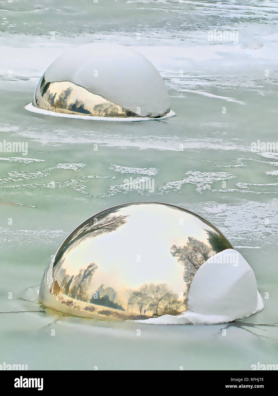 Silver balls in blue ice water Stock Photo - Alamy