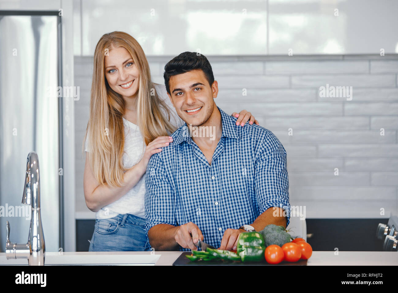 couple at home in a kitchen Stock Photo - Alamy