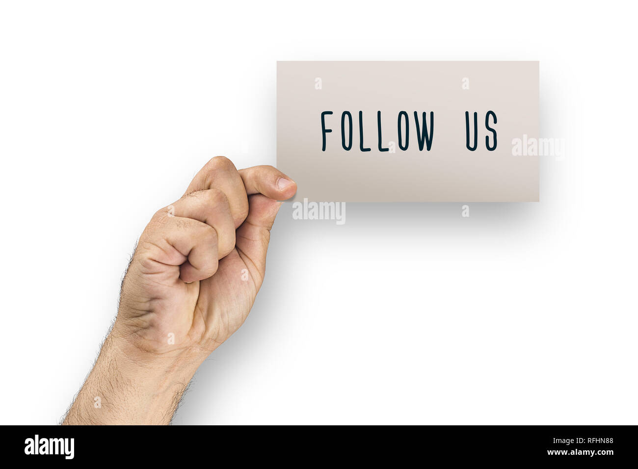 Follow us. Hand showing or holding card with text follow us in social ...