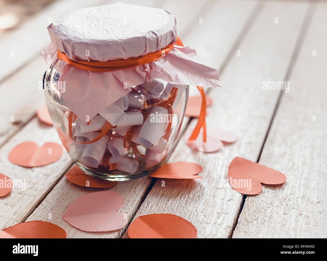 Glass jar on wood. Valentine's day concept. Date Jar with desires or ...