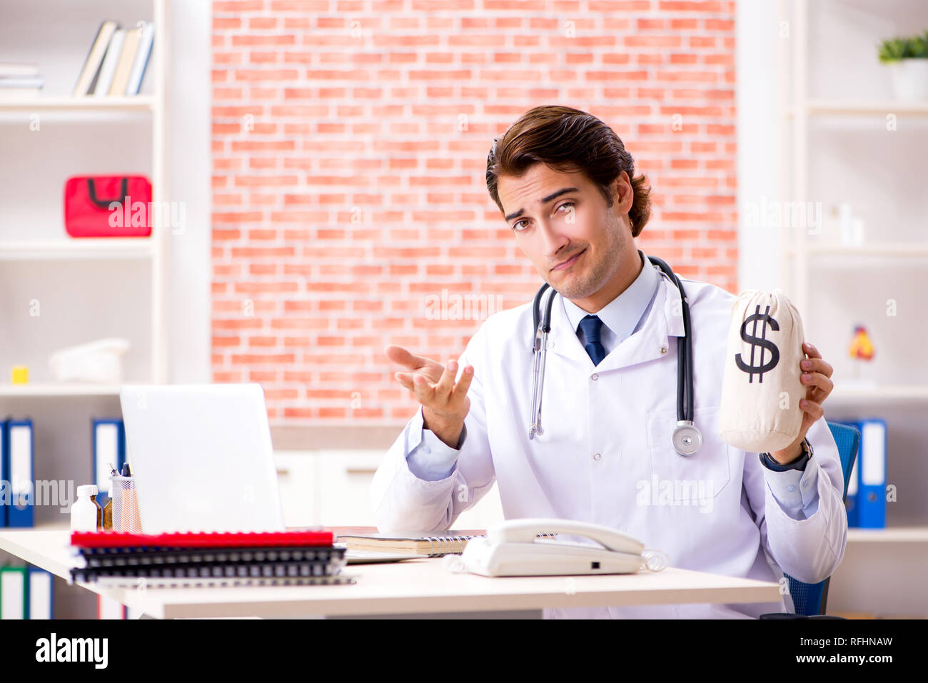 Young doctor working in hospital Stock Photo - Alamy