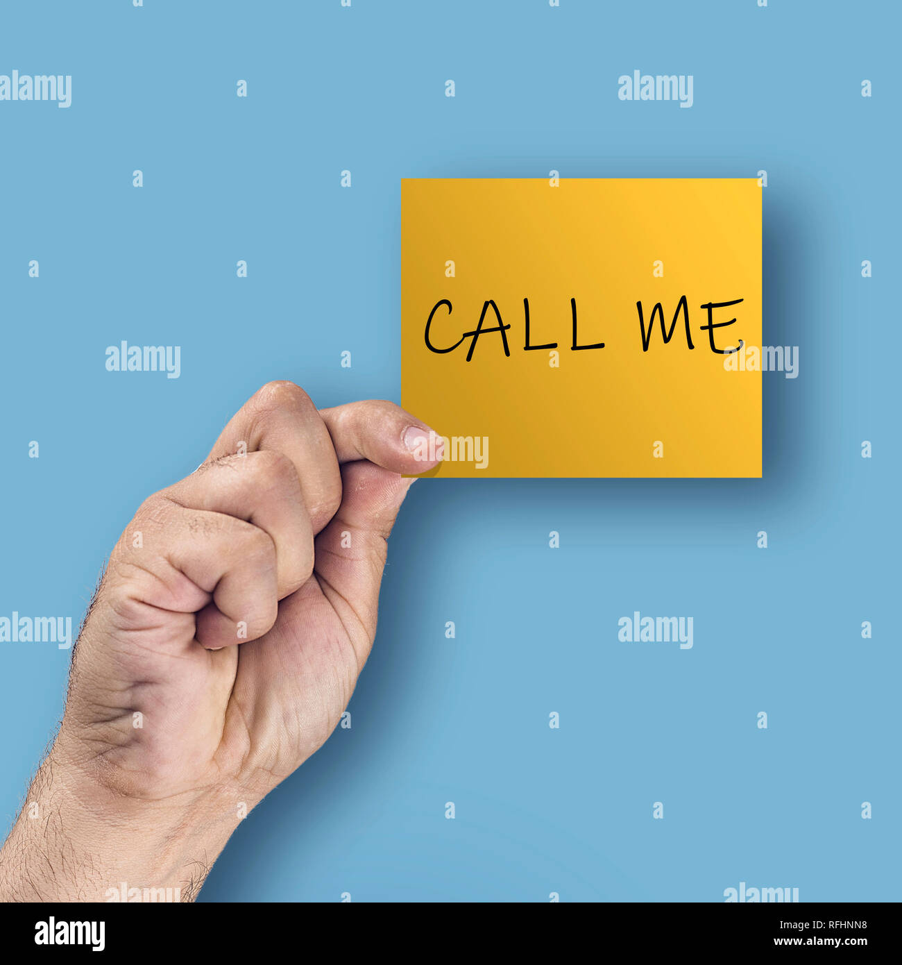 Call me. Hand showing or holding card with text Stock Photo - Alamy
