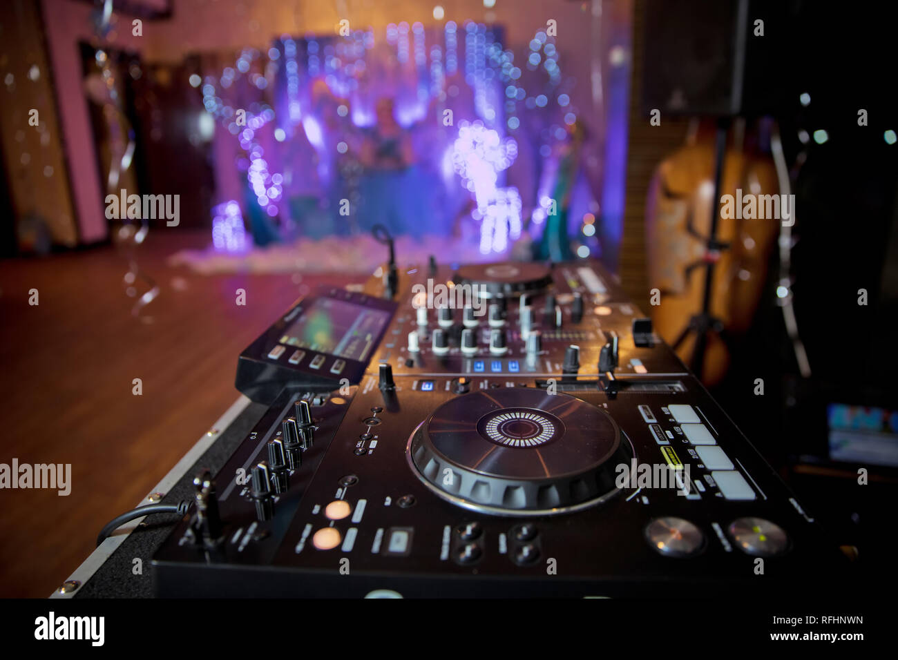 closeup hands of DJ at the control panel wearing in white shirt. disc ...