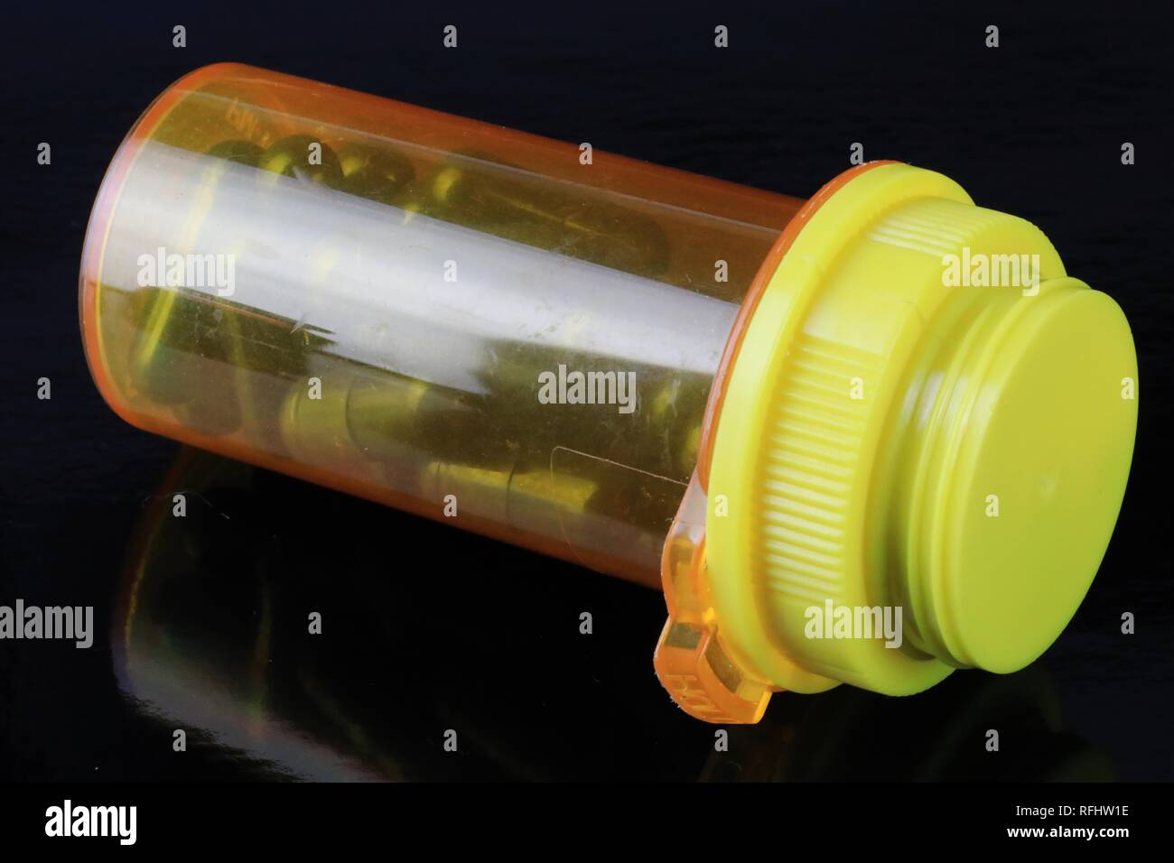 20 Dram Amber Vial with child proof cap Stock Photo - Alamy