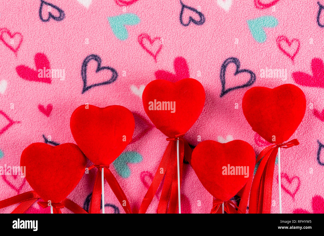 red valentines day hearts on heart shaped background Stock Photo - Alamy