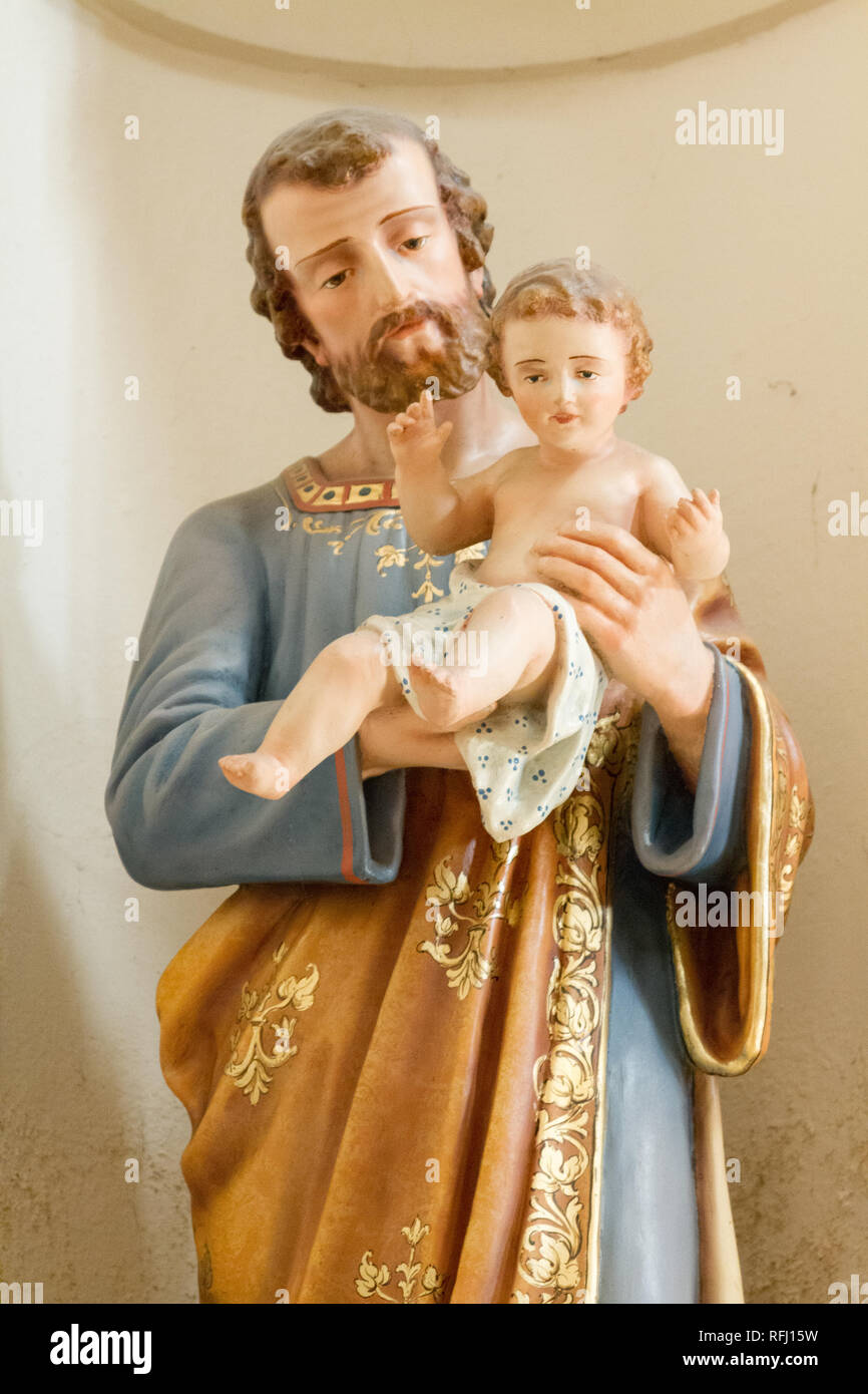 The statue of Saint Joseph holding baby Jesus in his arms. The Salesian ...