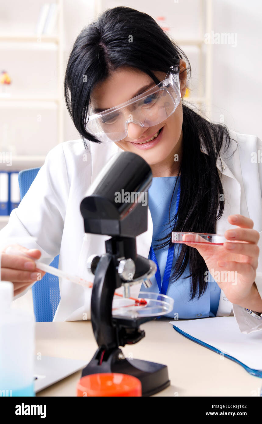 Female scientist mixing chemical solution hi-res stock photography and ...
